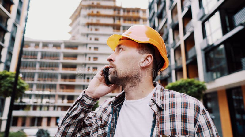 Engineer Talking on Phone. Architect Using Phone on Construction Site ...