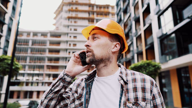 Engineer Talking on Phone. Architect Using Phone on Construction Site ...
