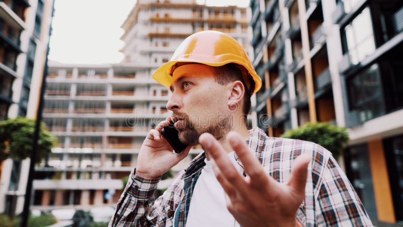Engineer Talking on Phone. Architect Using Phone on Construction Site ...