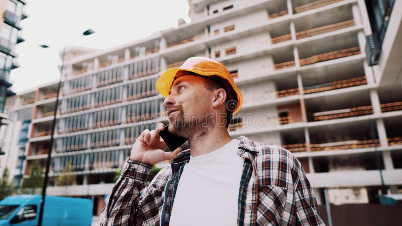 Engineer Talking on Phone. Architect Using Phone on Construction Site ...