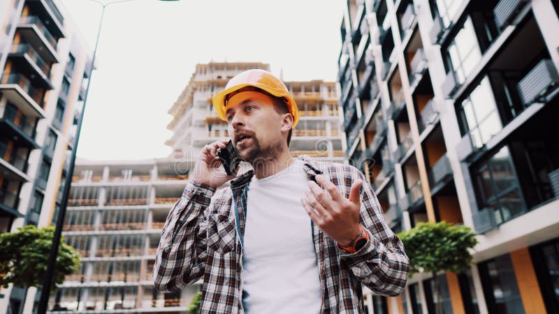 Engineer Talking on Phone. Architect Using Phone on Construction Site ...