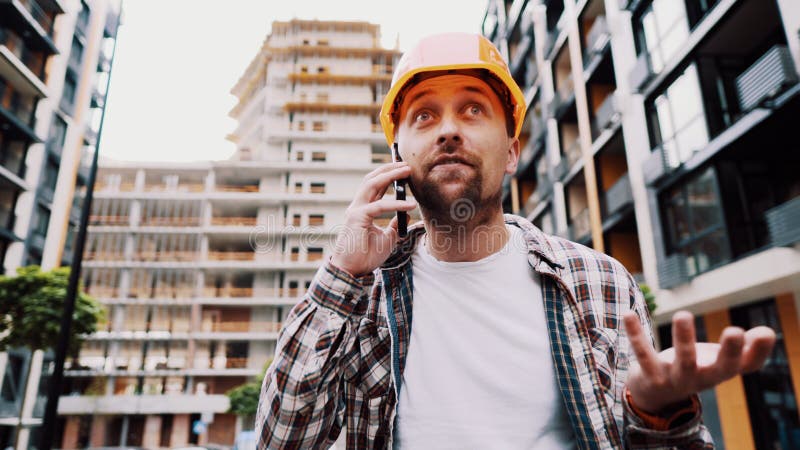 Engineer Talking on Phone. Architect Using Phone on Construction Site ...