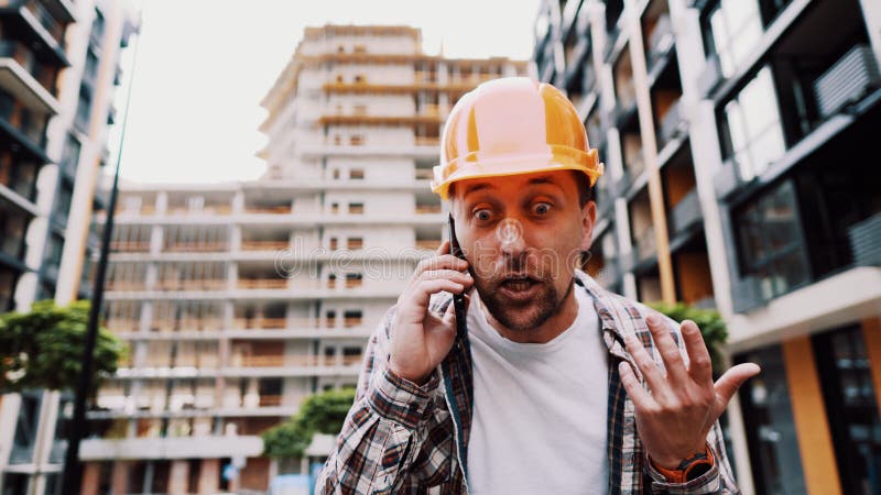 Engineer Talking on Phone. Architect Using Phone on Construction Site ...