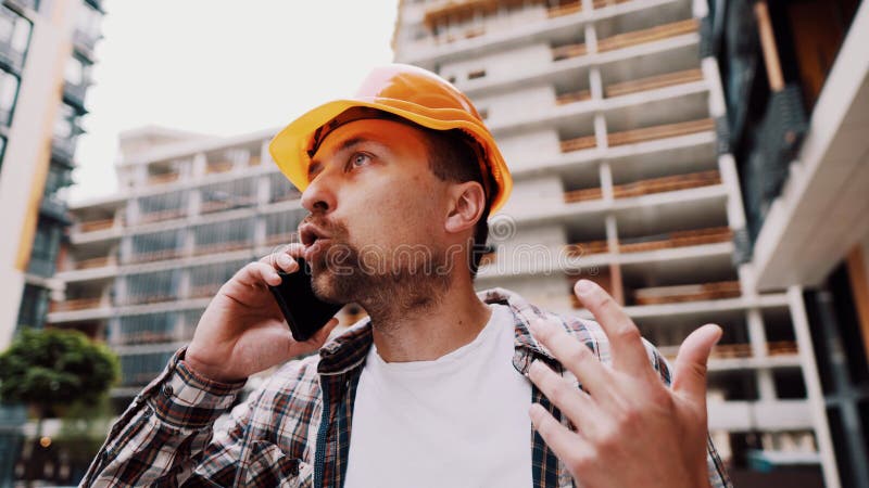 Engineer Talking on Phone. Architect Using Phone on Construction Site ...
