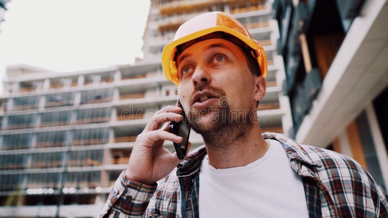 Engineer Talking on Phone. Architect Using Phone on Construction Site ...