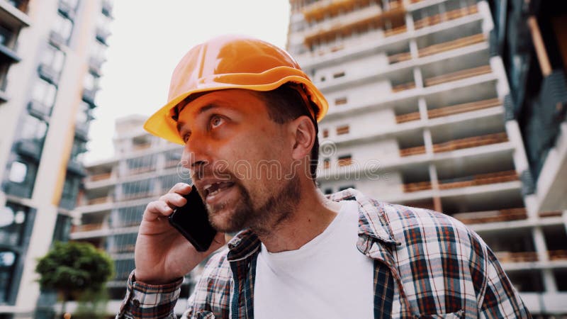 Engineer Talking on Phone. Architect Using Phone on Construction Site ...