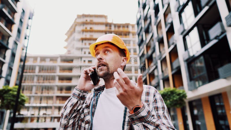 Engineer Talking on Phone. Architect Using Phone on Construction Site ...