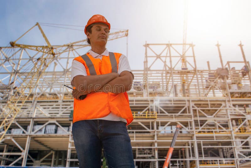 Engineer is Talking on Radio on Construction Site of Industrial Building Stock Photo - Image of ...