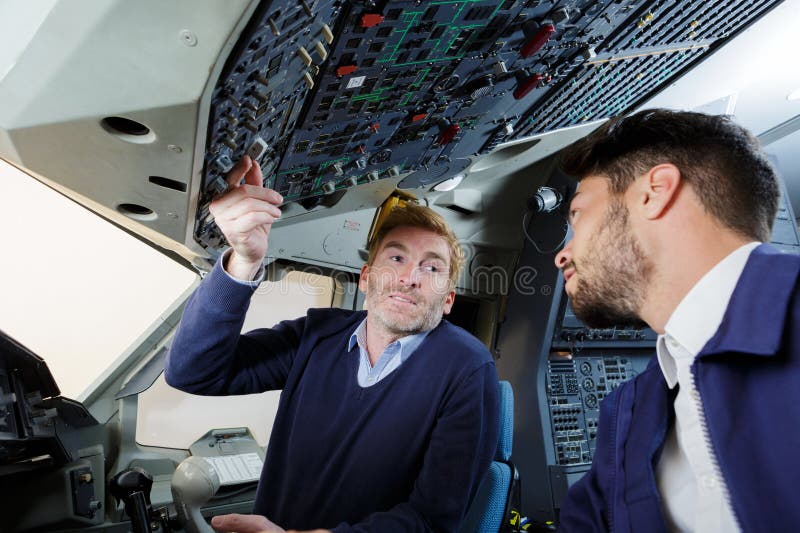 Engineer Talking To Trainee in Cockpit Aircraft Stock Image - Image of ...