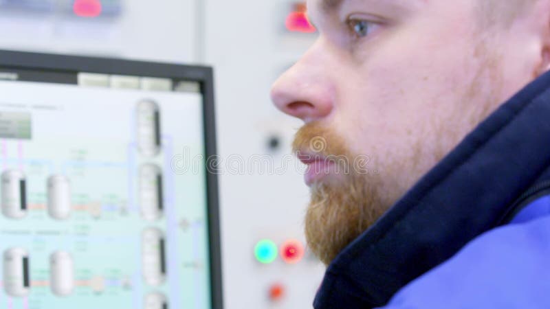 Engineer Talking on Walkie-talkie and Look at Screens Indicators in ...