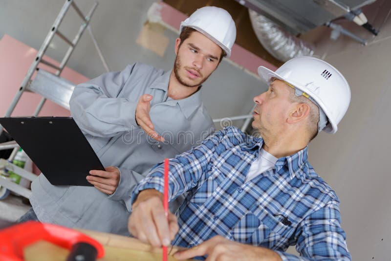 Engineer Teaching Apprentice Taking To Manager Stock Image - Image of ...