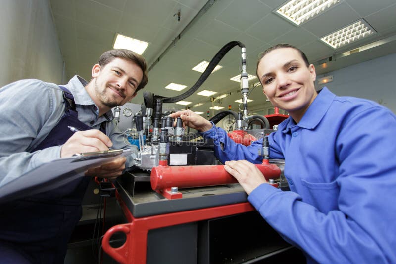 Engineer Teaching Apprentice To Use Computerized Lathe Stock Photo ...