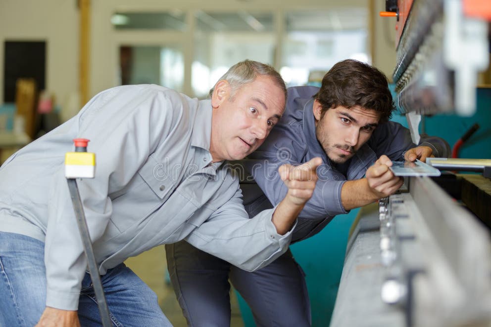Engineer Teaching Apprentice To Use Grinding Machine Stock Image ...