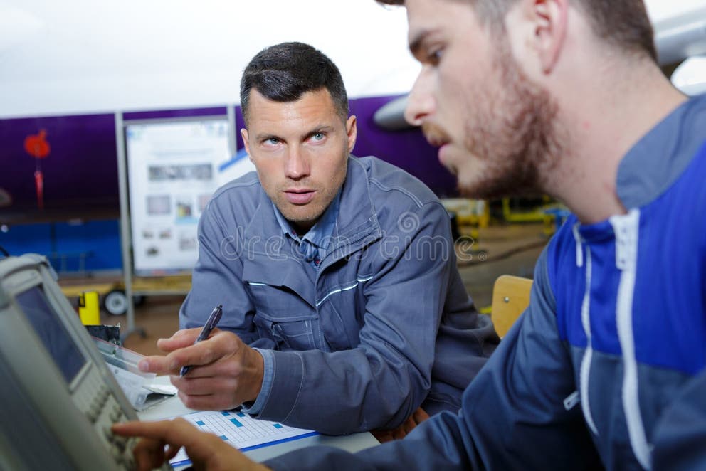 Engineer Teaching Apprentice To Use Machine Stock Image - Image of operating, caucasian: 260339637