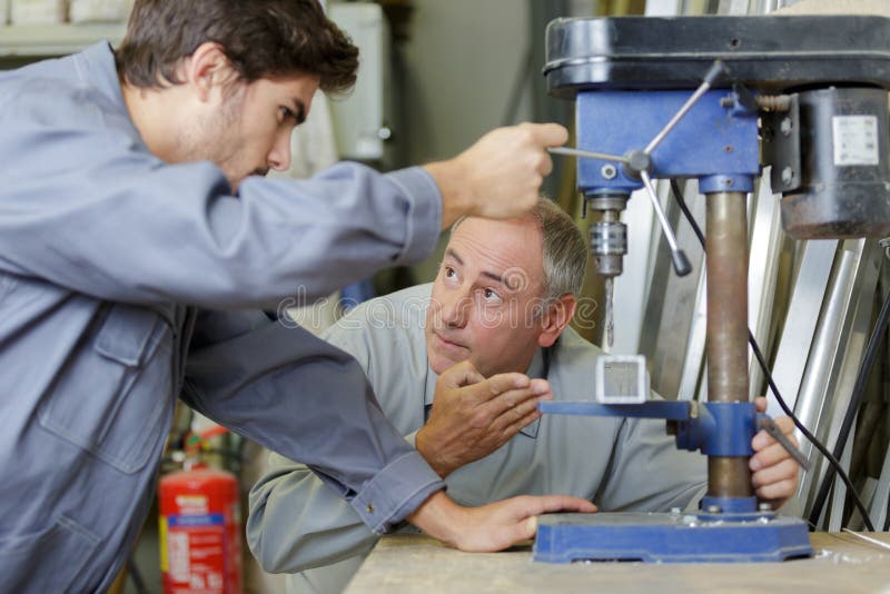 Engineer Teaching Apprentice To Use Milling Machine Stock Image - Image of sixties ...