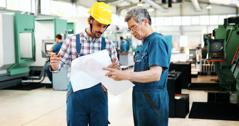 Engineer Teaching Apprentices To Use Computerized Cnc Metal Processing ...