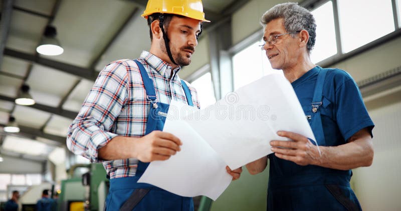 Engineer Teaching Apprentices To Use Computerized Cnc Metal Processing ...