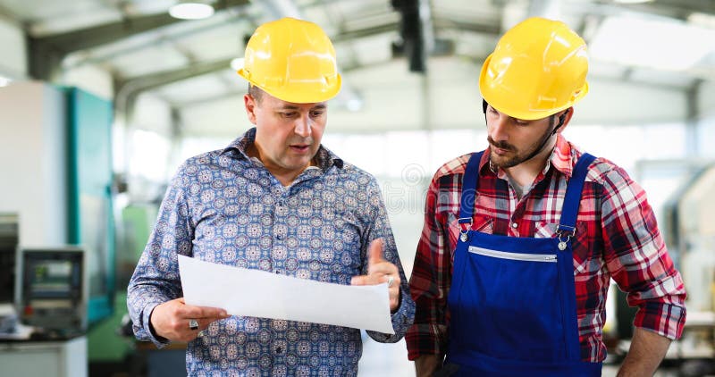 Engineer Teaching Apprentices To Use Computerized Cnc Metal Processing ...
