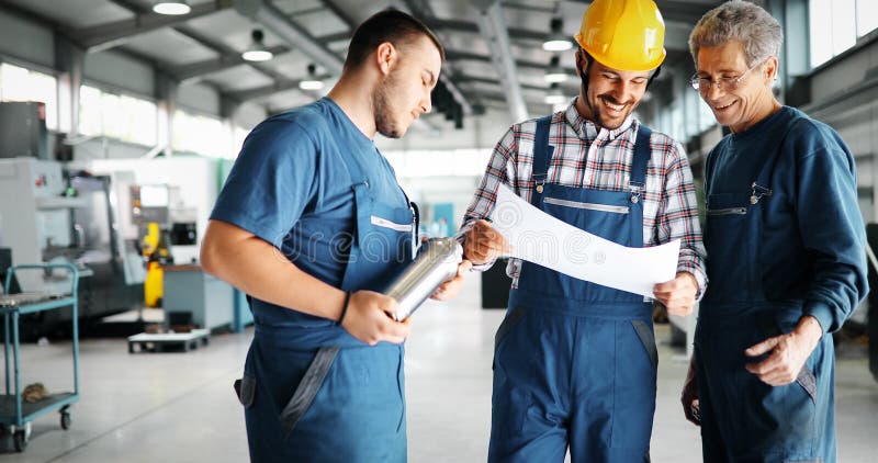 Engineer Teaching Apprentices To Use Computerized Cnc Metal Processing ...