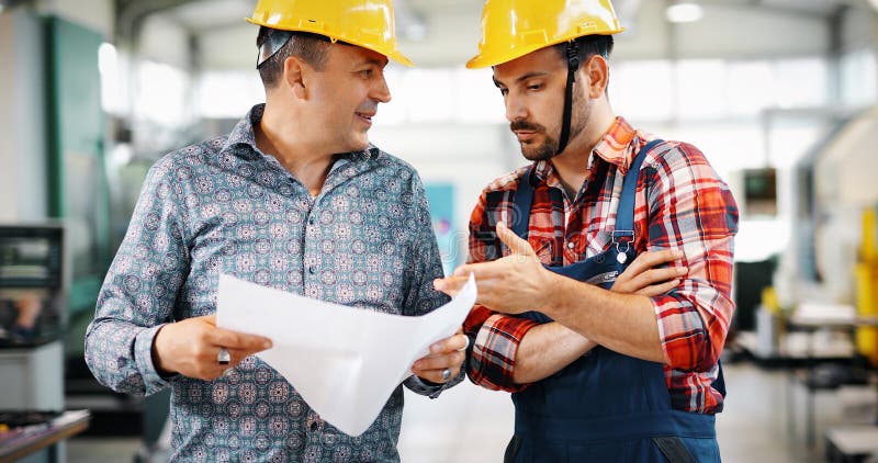 Engineer Teaching Apprentices To Use Computerized Cnc Metal Processing ...