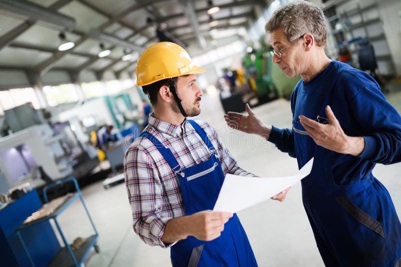 Engineer Teaching Apprentices To Use Computerized Cnc Metal Processing ...