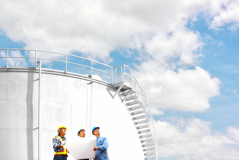 The Engineer Team Checking Plan of Raw Material Tank Construction ...