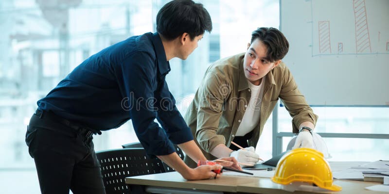 Engineer Team with Construction Work Plan Discussion Together Blueprint ...