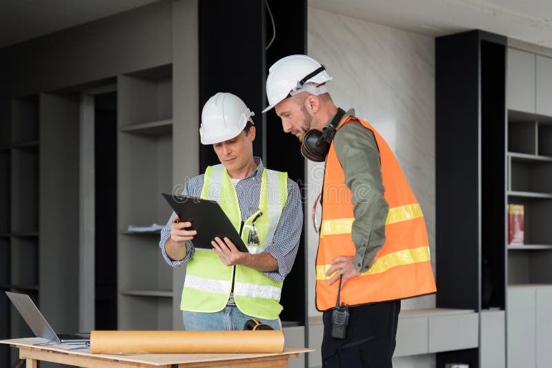 Engineer Team Discussing Meeting on Plan at Construction Site Stock ...