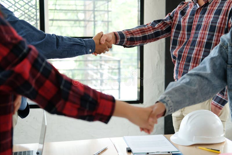 Engineer Team Handshaking. Architect Shaking Hands for Building ...