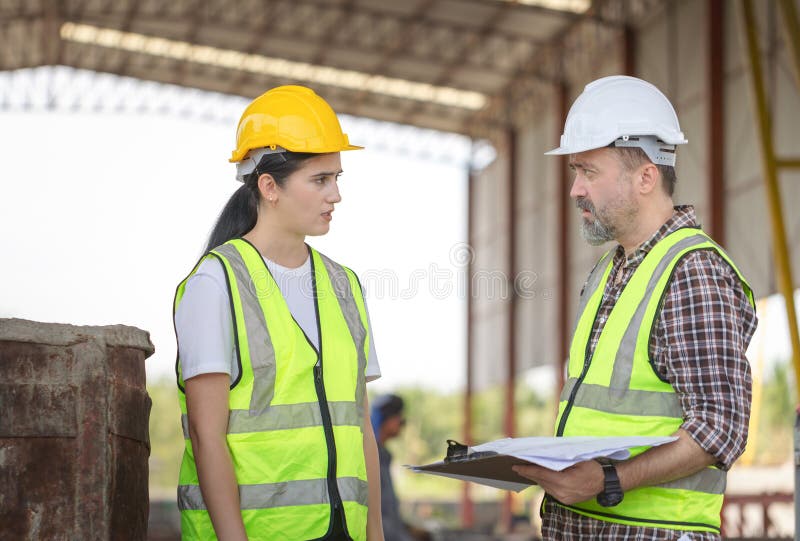 Senior Engineer and Female Foreman Team Checking Project at Precast ...