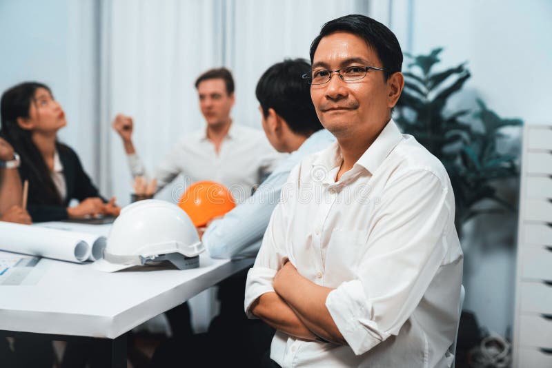 Diverse Group of Civil Engineer and Client Working on Architect ...