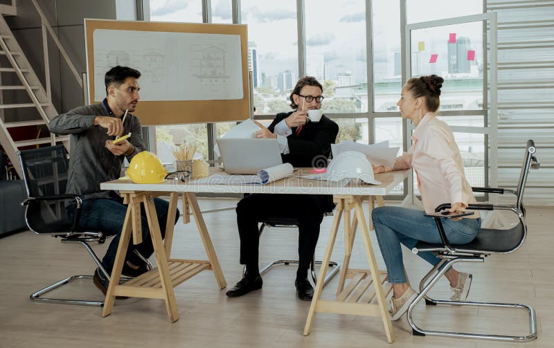 Engineer Team is Meeting To Inspect the Construction Blueprint Drawings ...