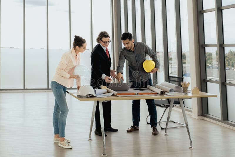 Engineer Team is Meeting To Inspect the Construction Blueprint Drawings ...