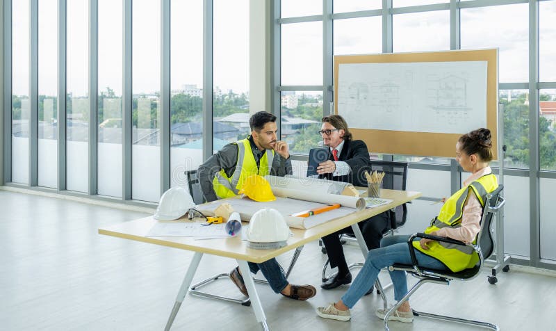 Engineer Team is Meeting To Inspect the Construction Blueprint Drawings ...