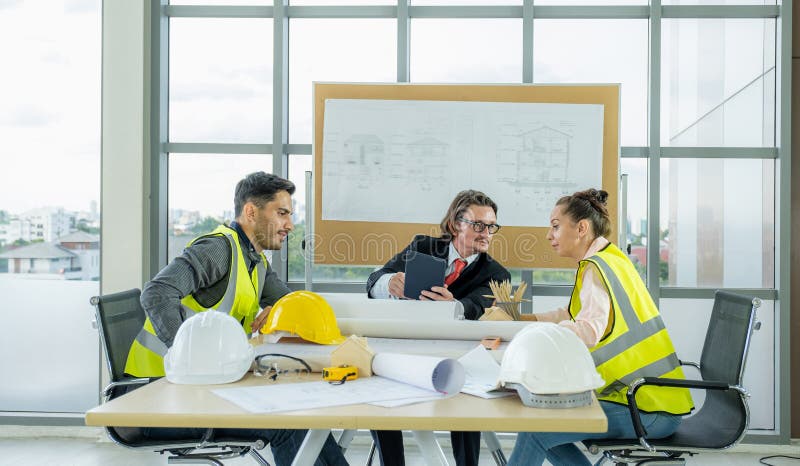 Engineer Team is Meeting To Inspect the Construction Blueprint Drawings ...