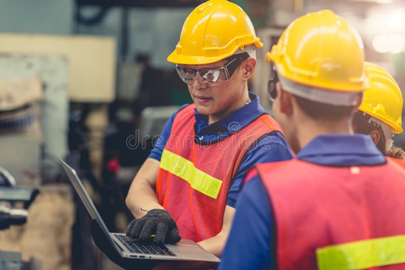 Engineer Team Mix Race Working Together in Heavy Industry with Laptop ...
