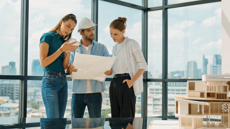 Engineer Team Talk about Design while Manager Hold at Project Plan ...