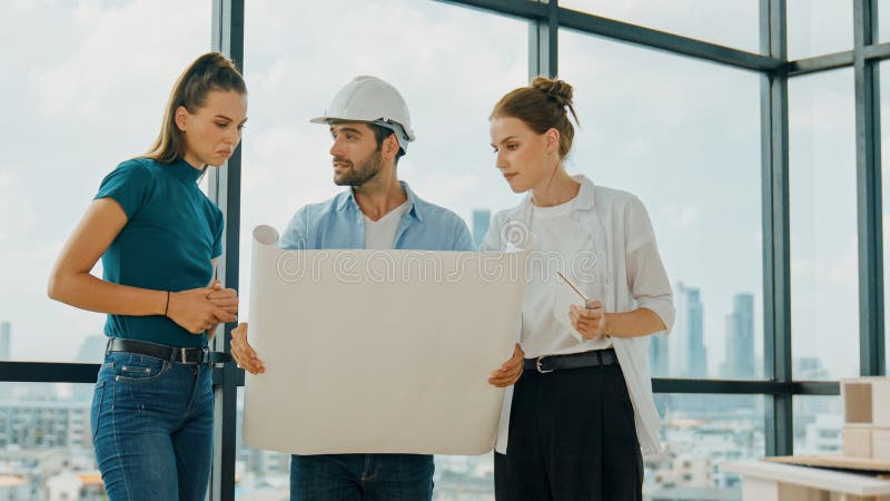 Engineer Team Talk about Design while Manager Hold at Project Plan ...