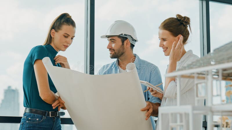 Engineer Team Talk about Design while Manager Hold at Project Plan ...