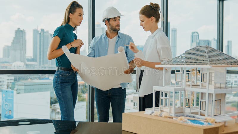 Engineer Team Talk about Design while Manager Hold at Project Plan ...