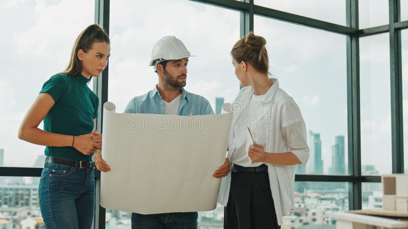 Professional Architect Team Working Together To Design House Model ...