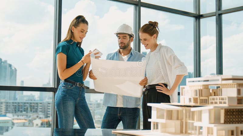 Engineer Team Talk about Design while Manager Hold at Project Plan ...