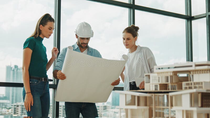 Engineer Team Talk about Design while Manager Hold at Project Plan ...