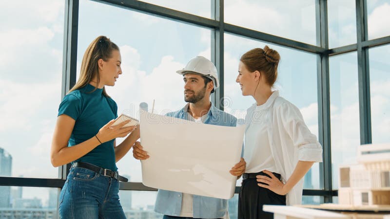 Engineer Team Talk about Design while Manager Hold at Project Plan ...