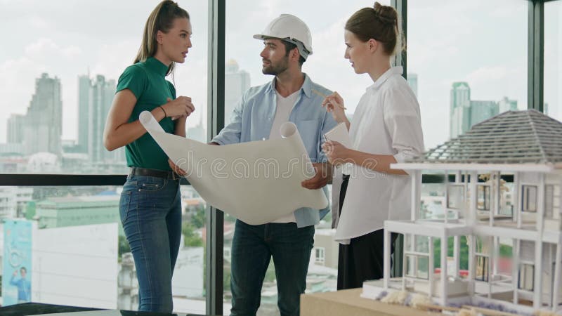 Engineer Team Talk about Design while Manager Hold at Project Plan ...