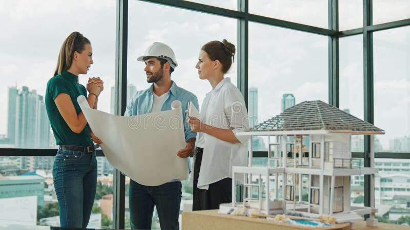 Engineer Team Talk about Design while Manager Hold at Project Plan ...