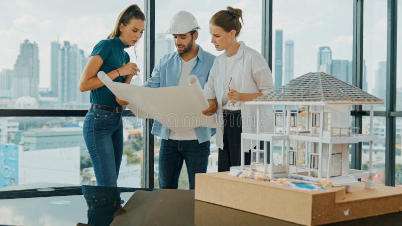 Engineer Team Talk about Design while Manager Hold at Project Plan ...