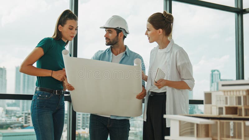 Engineer Team Talk about Design while Manager Hold at Project Plan ...