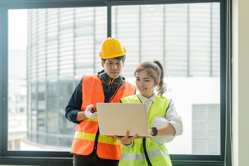 Engineer Team Wearing Reflective Jackets Discussing Construction ...