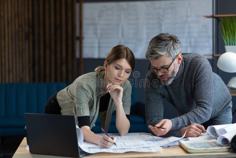 Engineer Team Working in Office with Blueprints and Architect Equipment ...